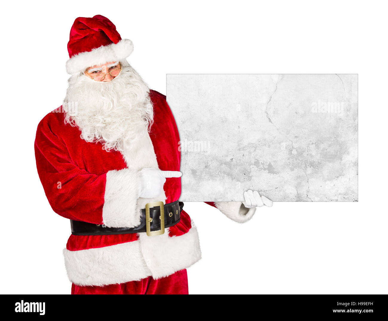 traditional classic red white santa claus pointing with his finger on ...