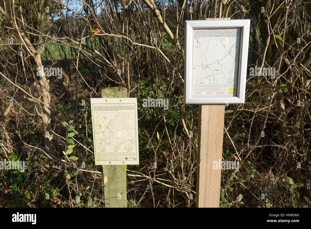 A picture of two signposts with maps to show the route around the field ...