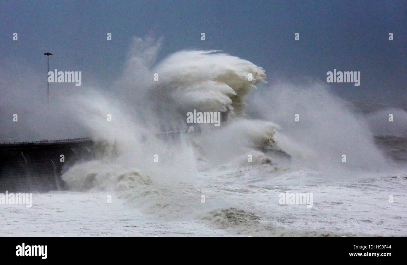 Waves crash over the harbour wall in Dover, Kent, as Storm Angus hit ...