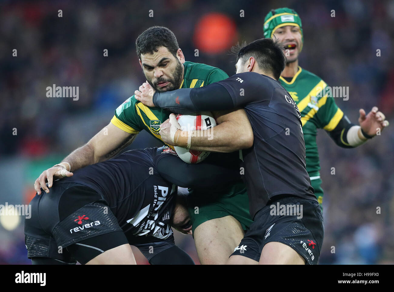 Australia's Greg Inglis (centre) in action with New Zealand's Lewis ...