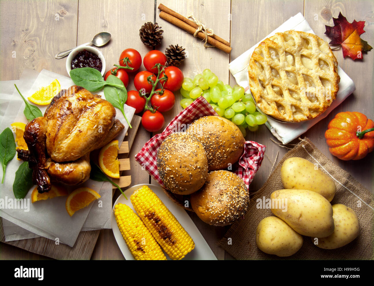 Seasonal savoury and sweet food selection on top of a wooden background ...