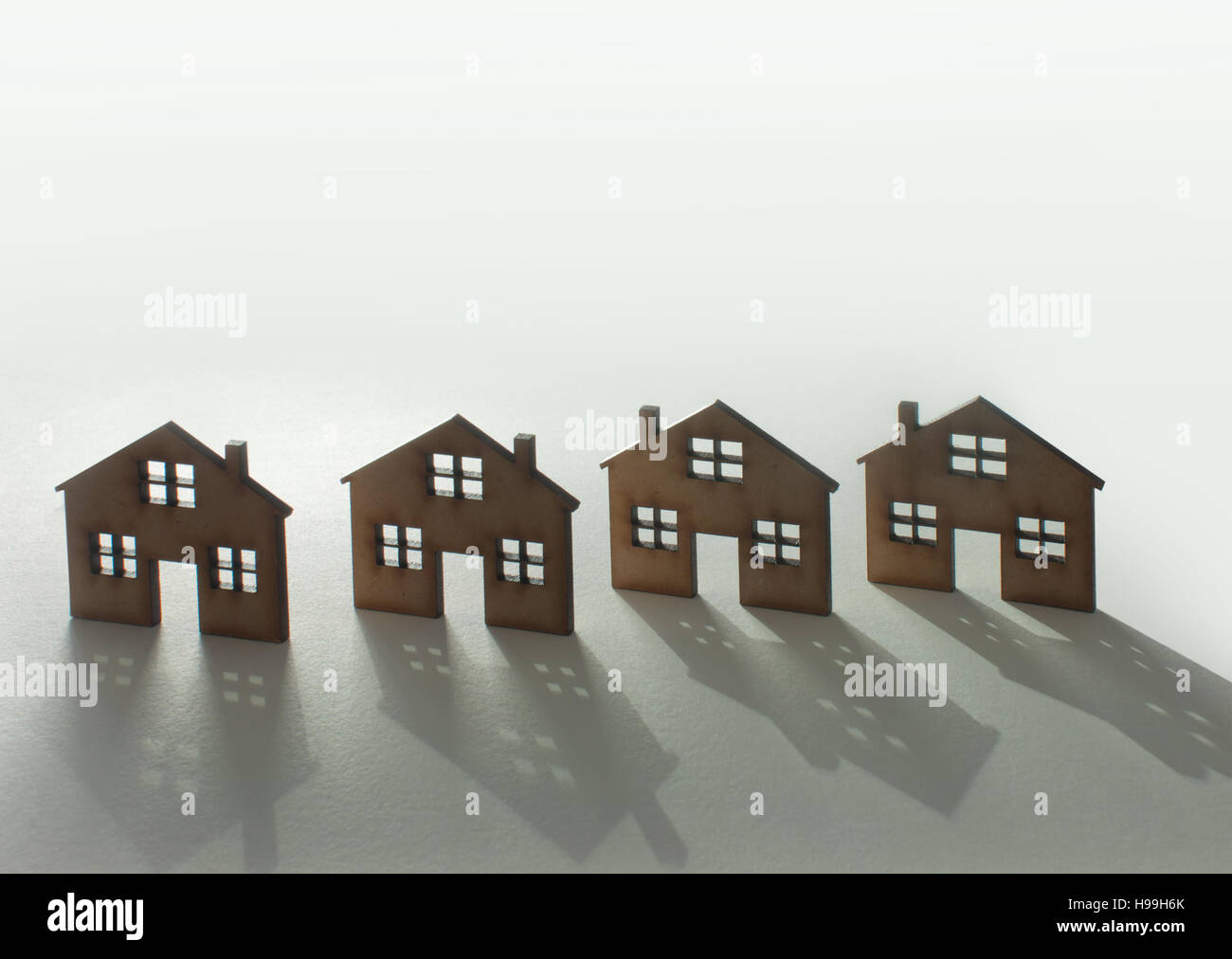 Small houses in a row with space for text Stock Photo - Alamy