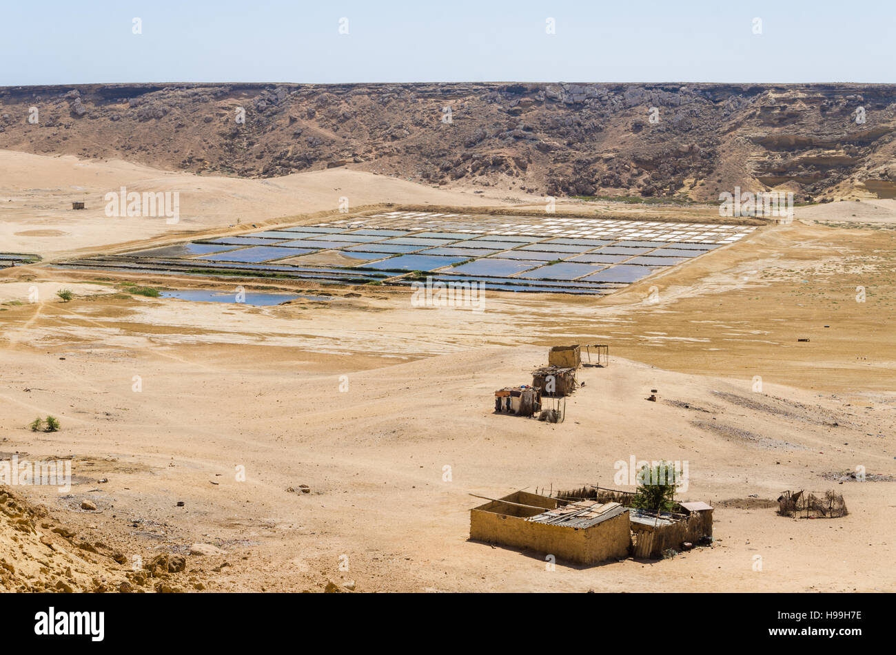 Traditional sea salt farming in square pools at Angola's Namib Desert ...