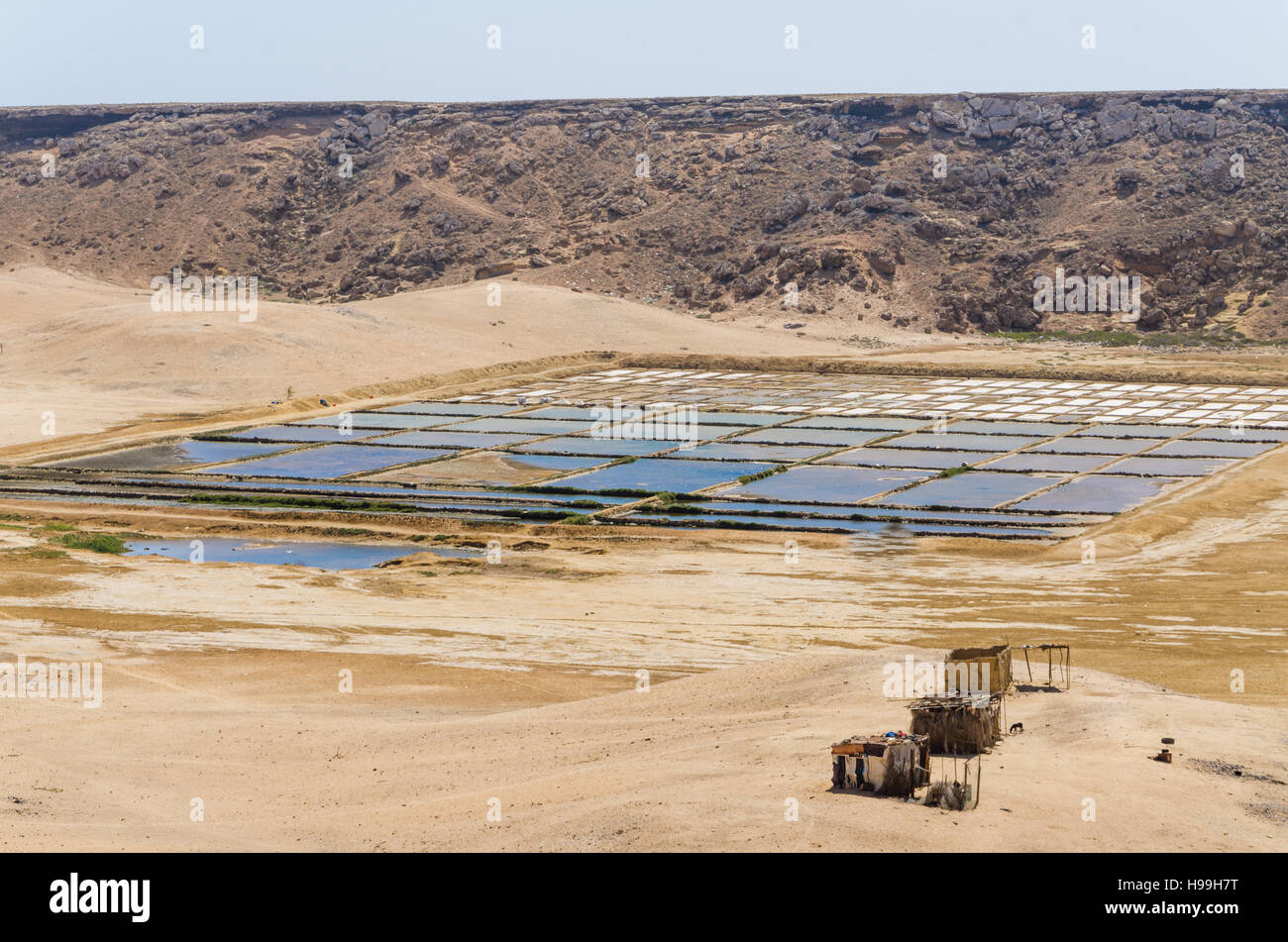 Traditional sea salt farming in square pools at Angola's Namib Desert ...