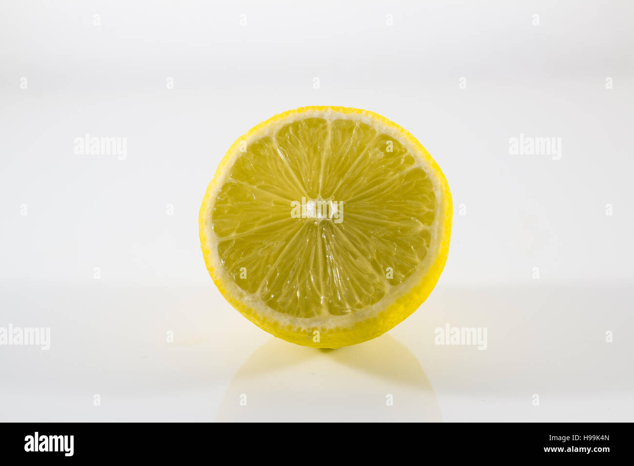 Lemon cut in half isolated Stock Photo - Alamy