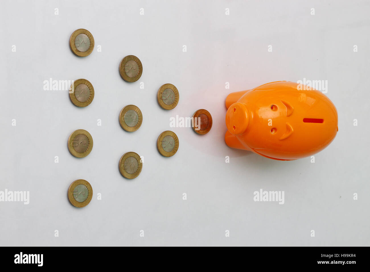 Piggy bank and ten rupee coin of India. Pyramid pattern design Stock ...