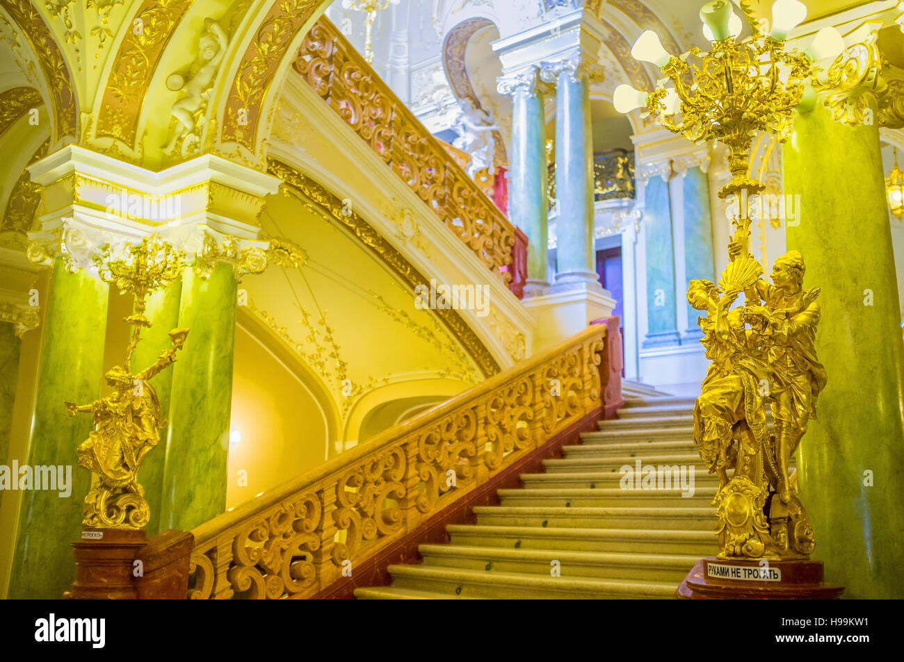 The interior of the Opera Theatre is rich on golden candelabrum and ...