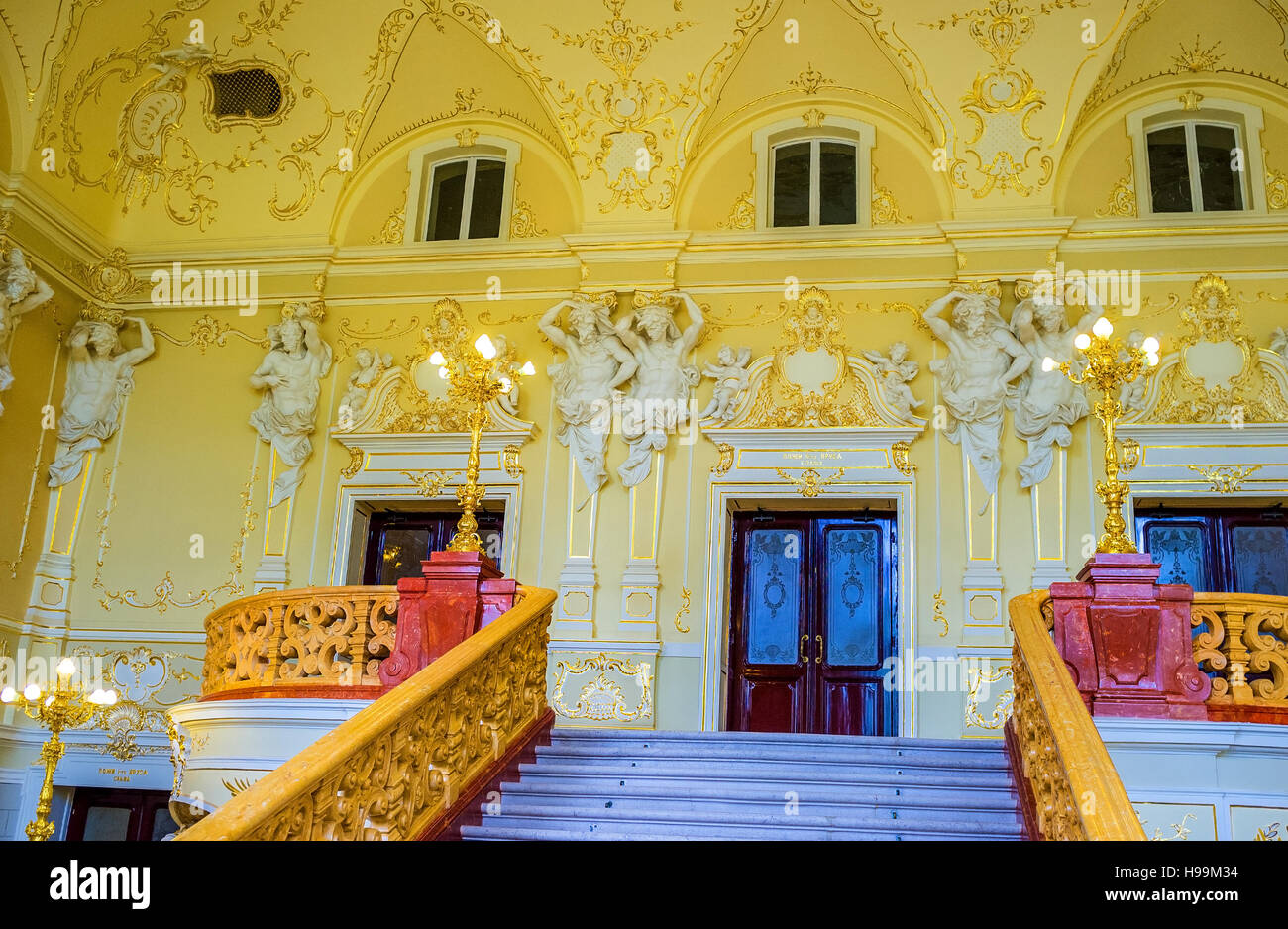 The staircases leads to the richly decorated balcony with entrances to ...