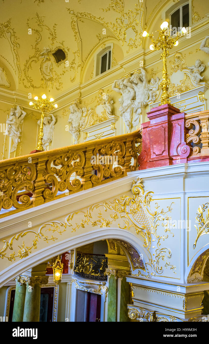 The walls of the principal staircases are decorated with golden ...