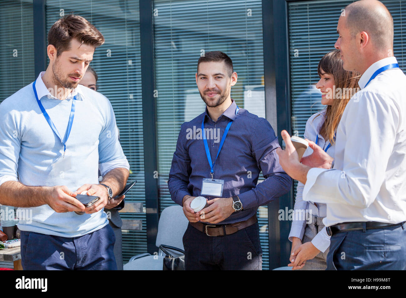 Business people taking a break outdoors Stock Photo - Alamy