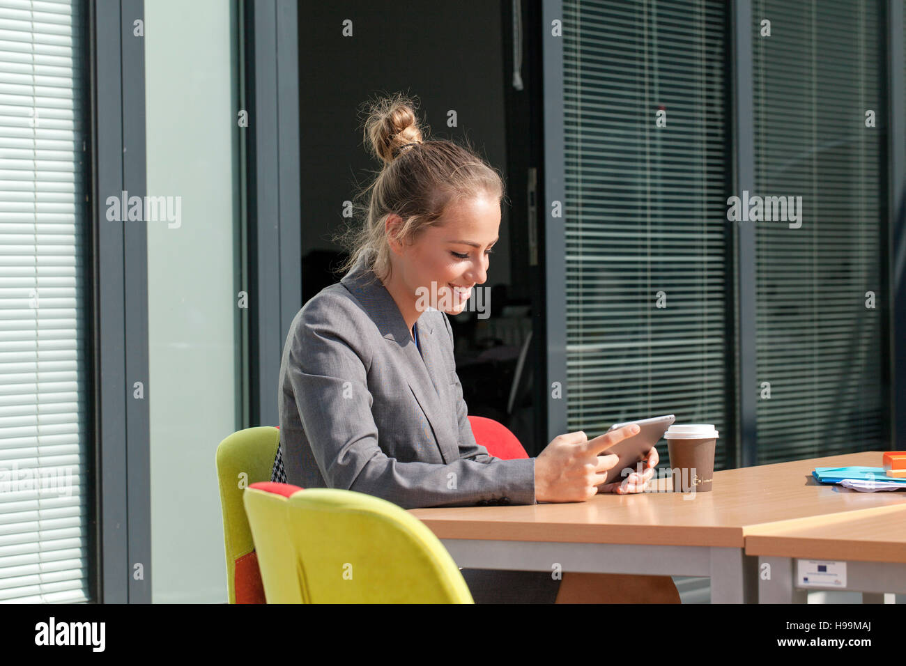 Young businesswoman in office surfing the net Stock Photo - Alamy