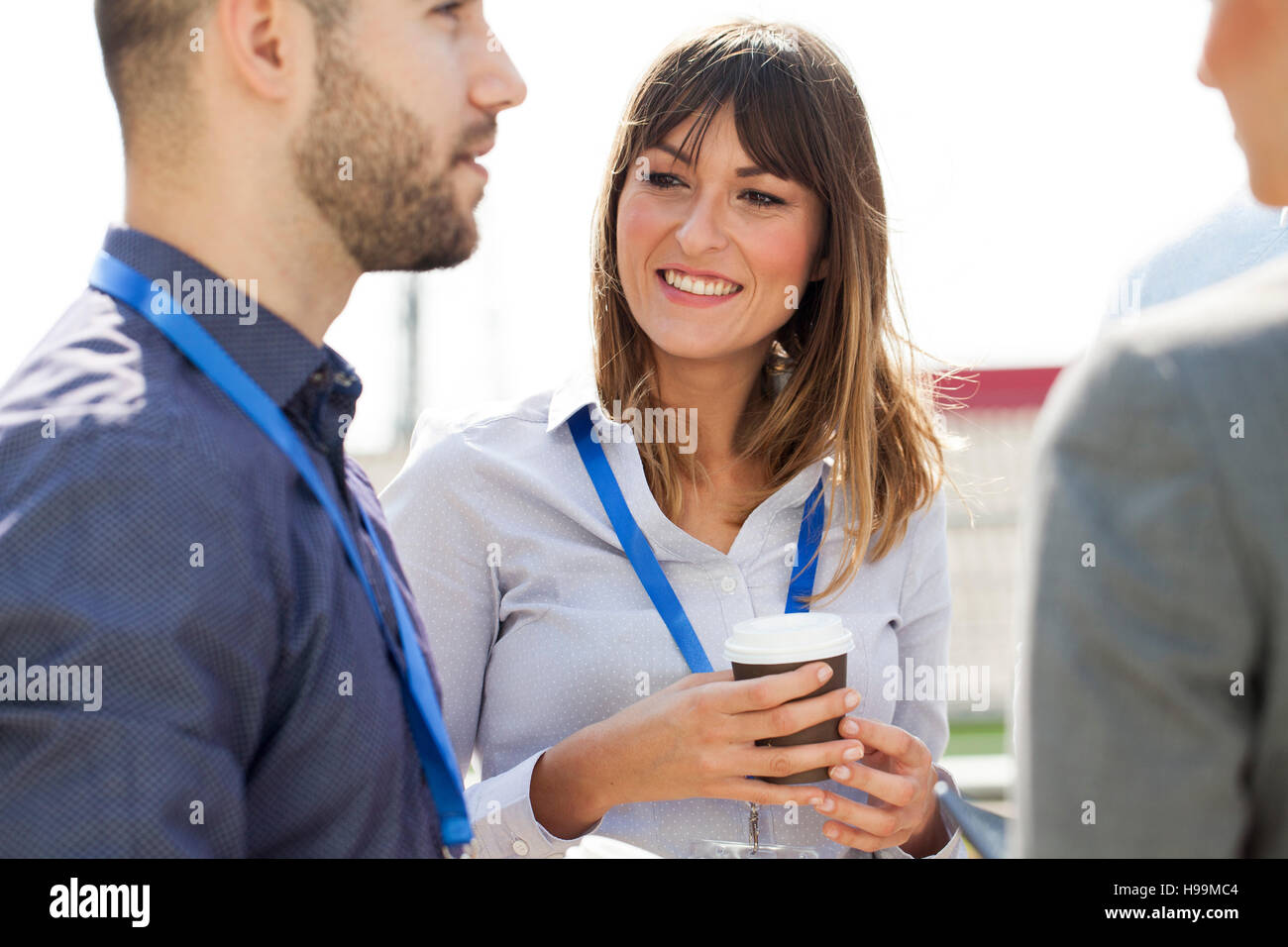 Business people taking a coffee break outdoors Stock Photo - Alamy