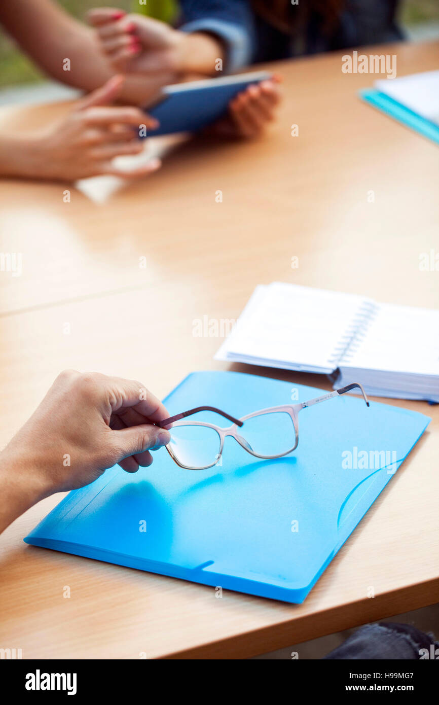 Document placed on table in business meeting Stock Photo - Alamy