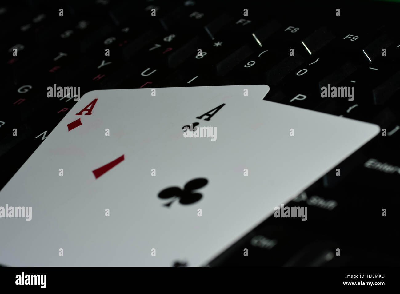 two ace card on keyboard Stock Photo - Alamy