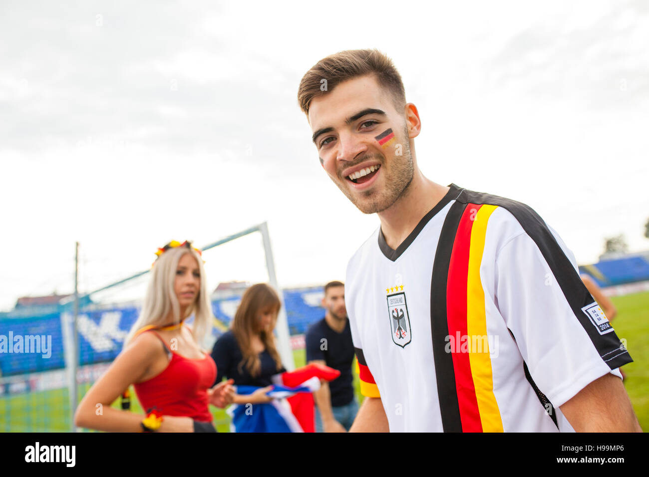 Portrait of German soccer fan with face paint Stock Photo - Alamy