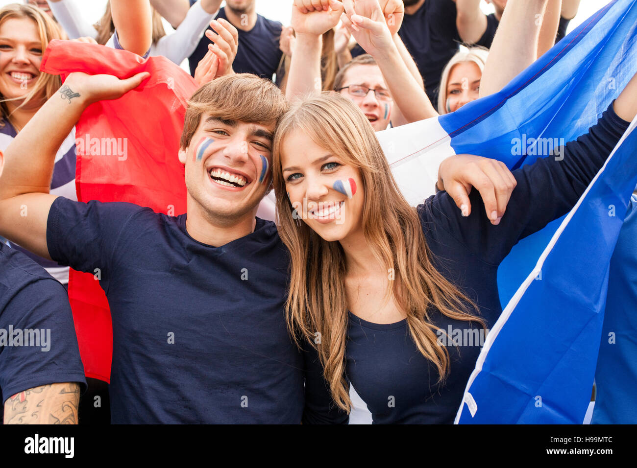 Group of soccer fans celebrating with French flag Stock Photo - Alamy