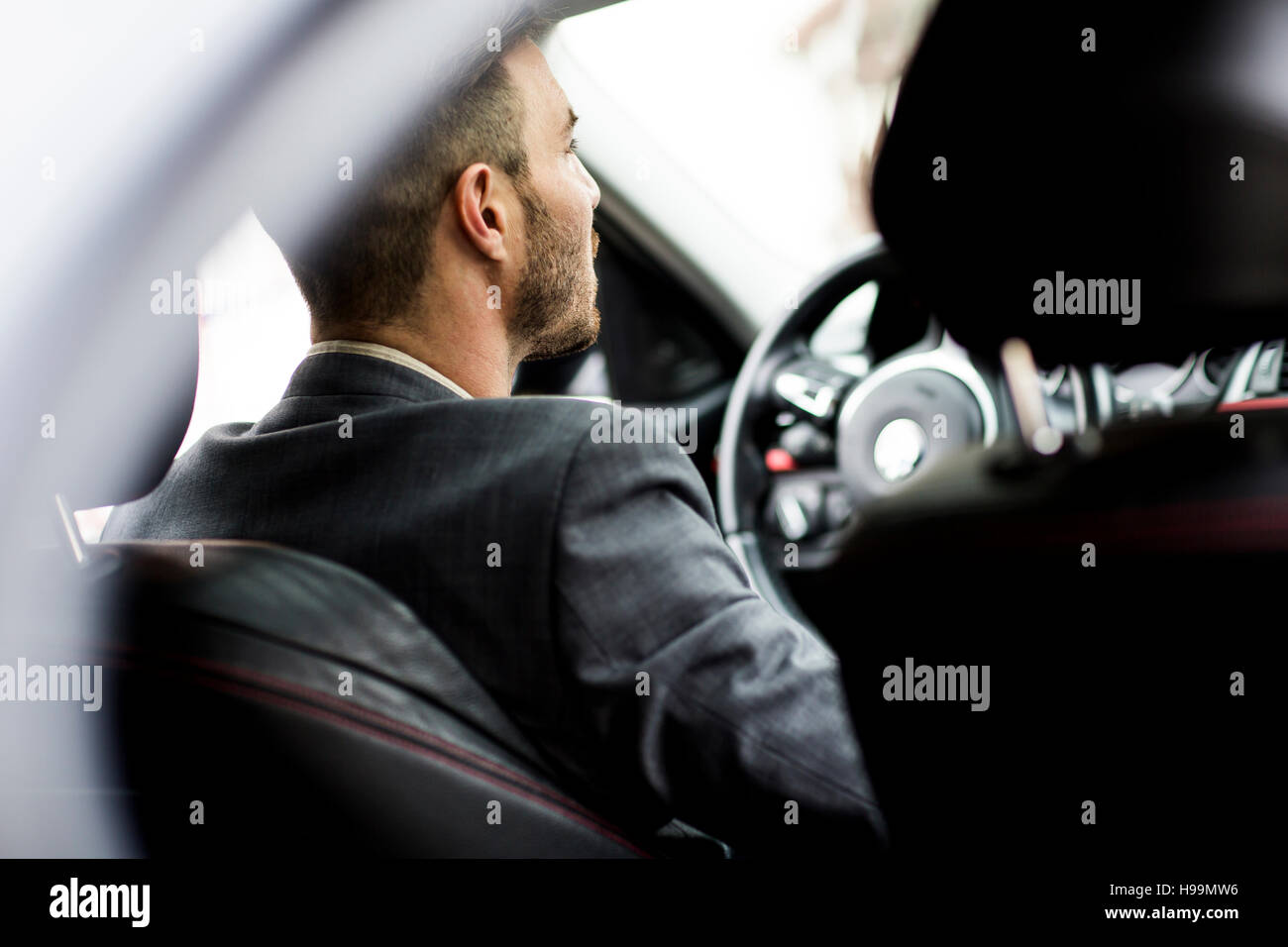 Young man driving in the modern car Stock Photo - Alamy