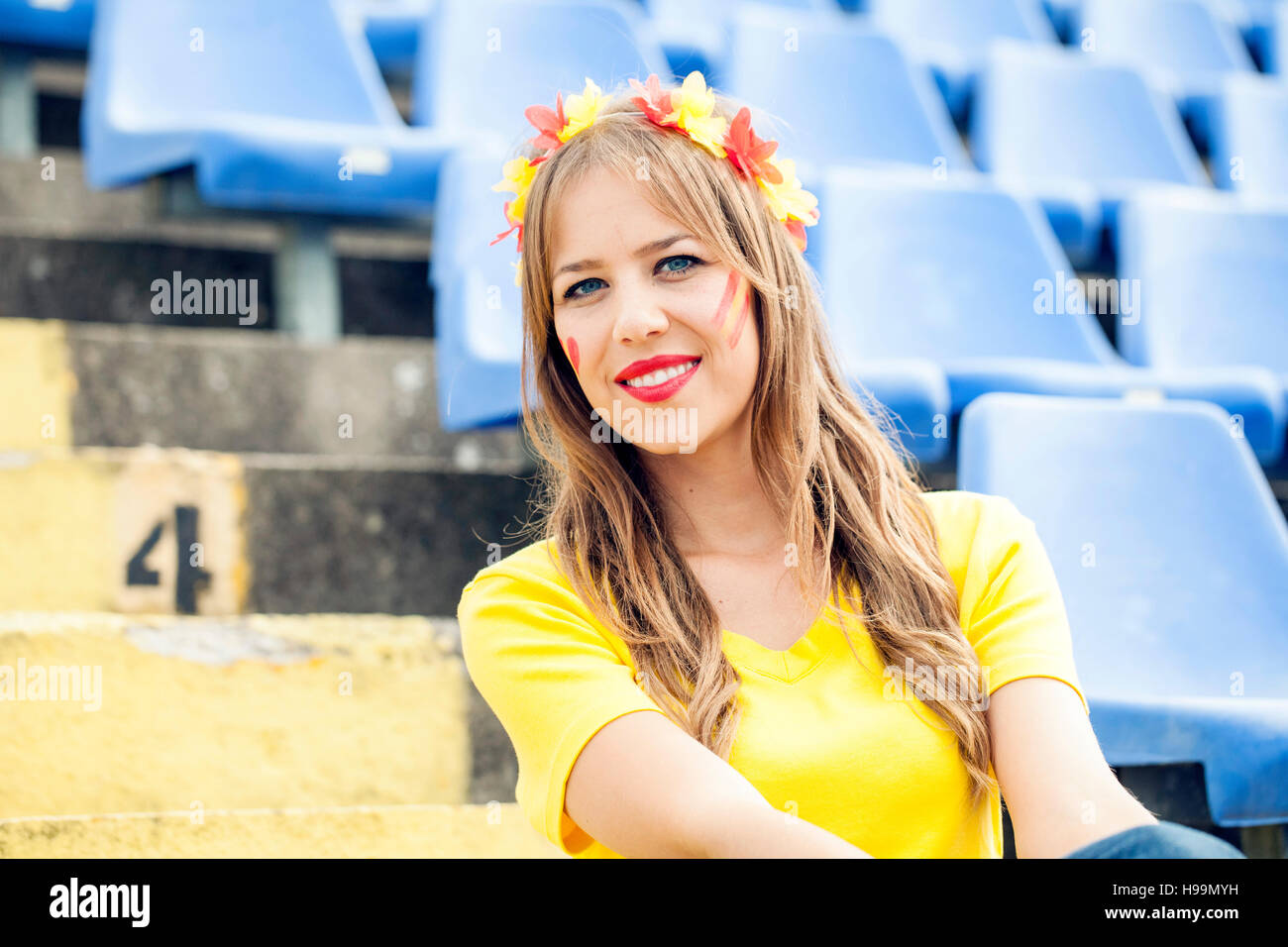 Portrait of female soccer fan with floral garland Stock Photo - Alamy