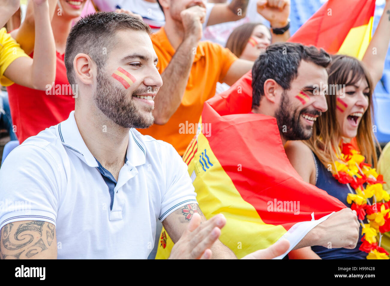 Group of soccer fans shouting in stadium Stock Photo - Alamy