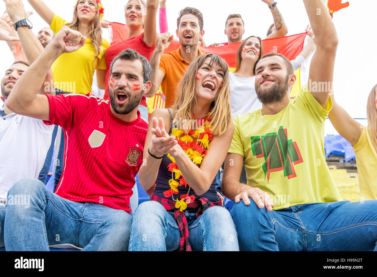 Soccer fans cheering and shouting in stadium Stock Photo - Alamy