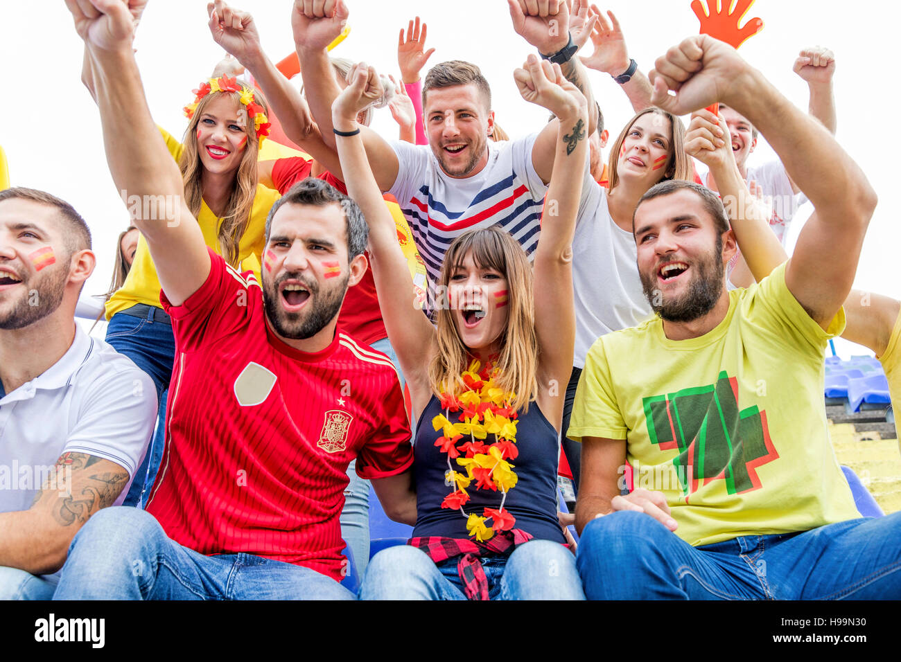 Soccer fans cheering and shouting in stadium Stock Photo - Alamy