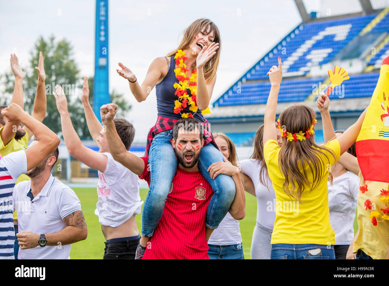 Group of Spanish soccer fans celebrating in stadium Stock Photo - Alamy