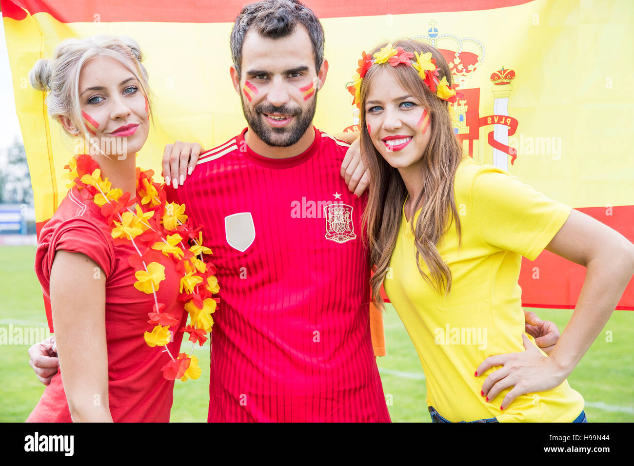 Portrait of Spanish soccer fans with face paint Stock Photo - Alamy