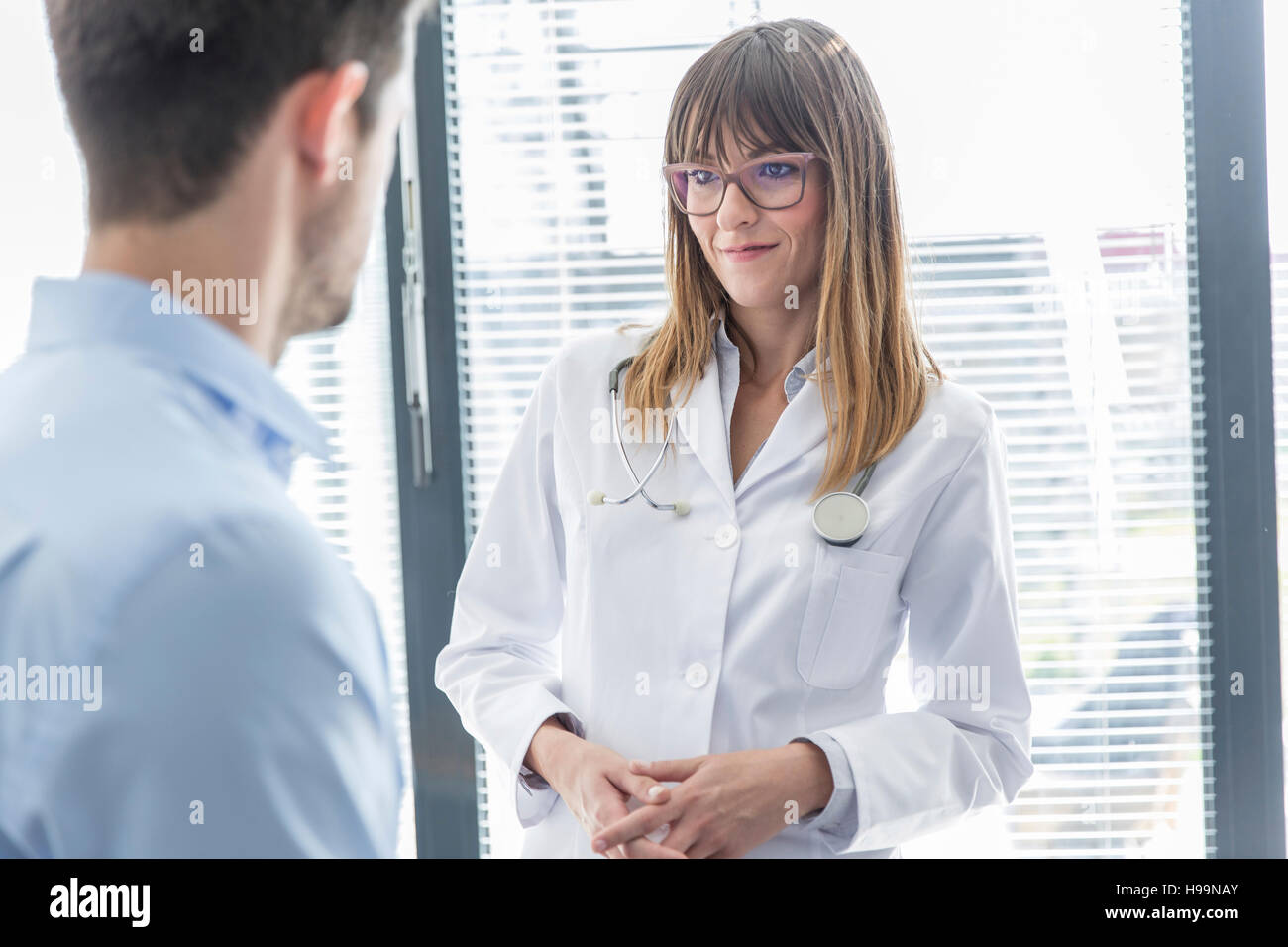 Female doctor in hospital talking hi-res stock photography and images ...
