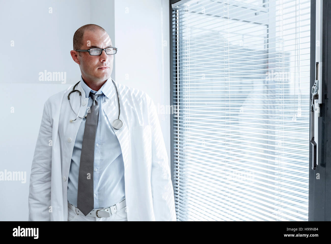Portrait of doctor with eyeglasses and stethoscope Stock Photo - Alamy