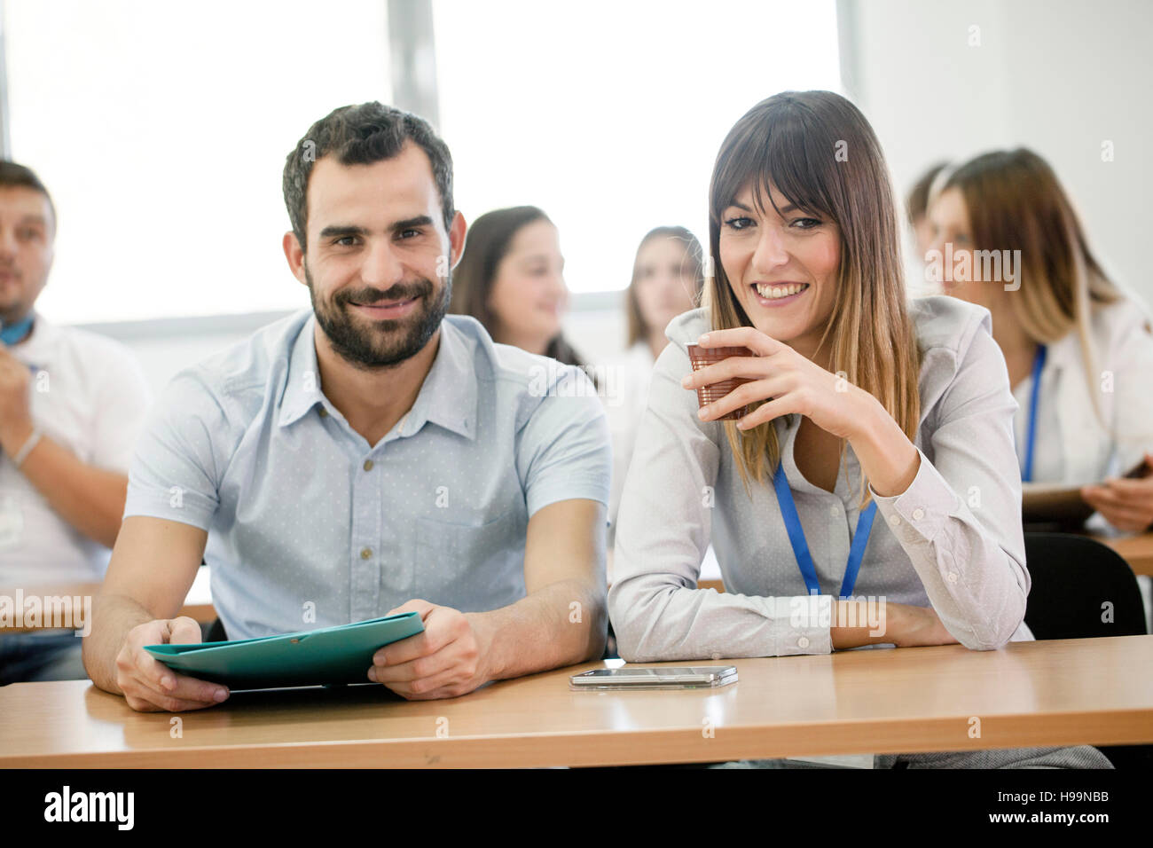 Students in training class taking a break Stock Photo - Alamy