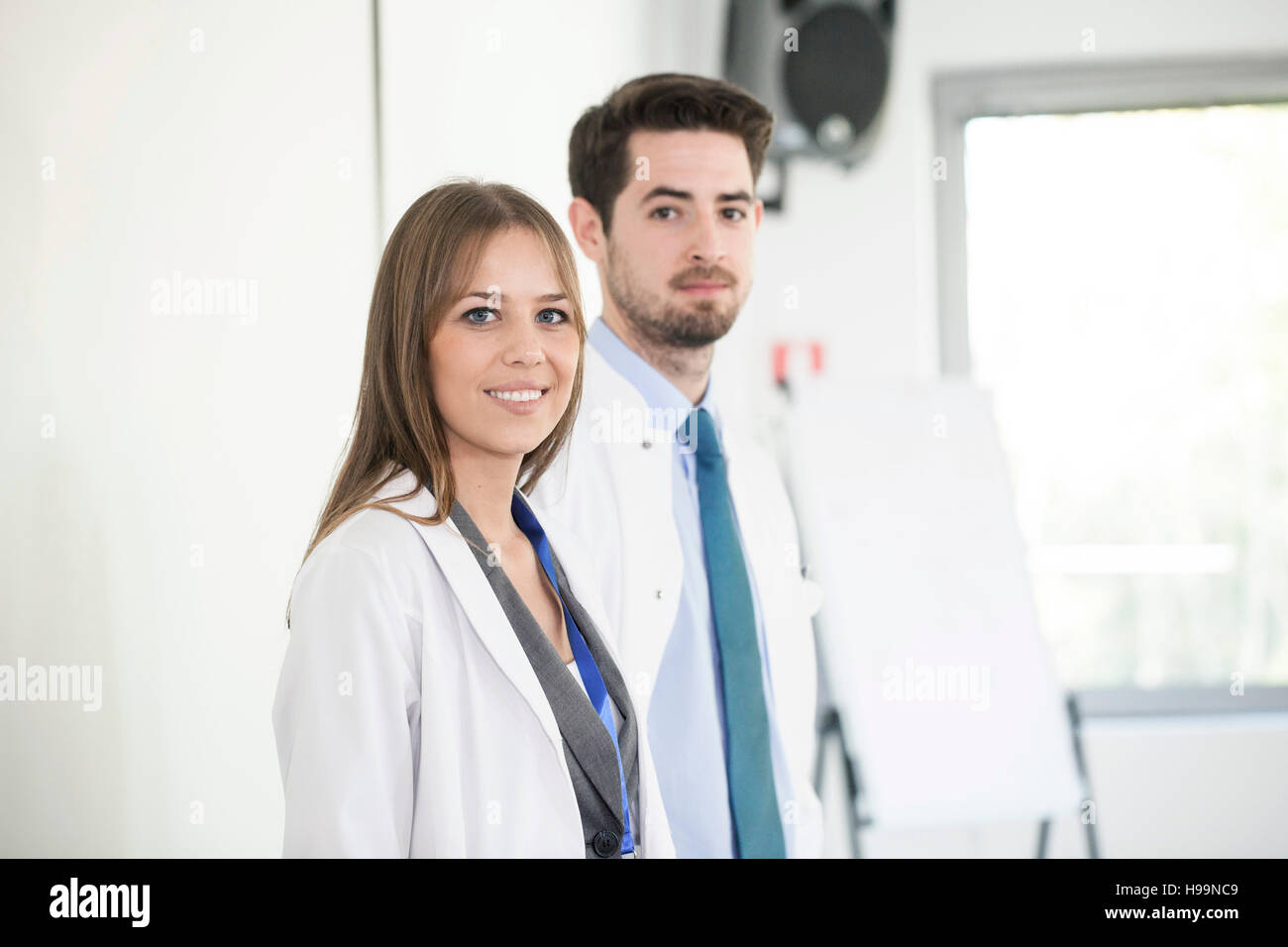 Female doctor and colleague teaching in training class Stock Photo - Alamy