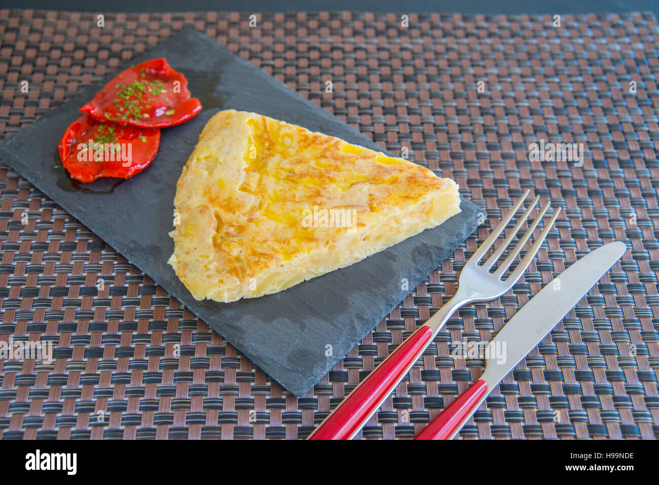 Spanish omelet serving Stock Photo - Alamy