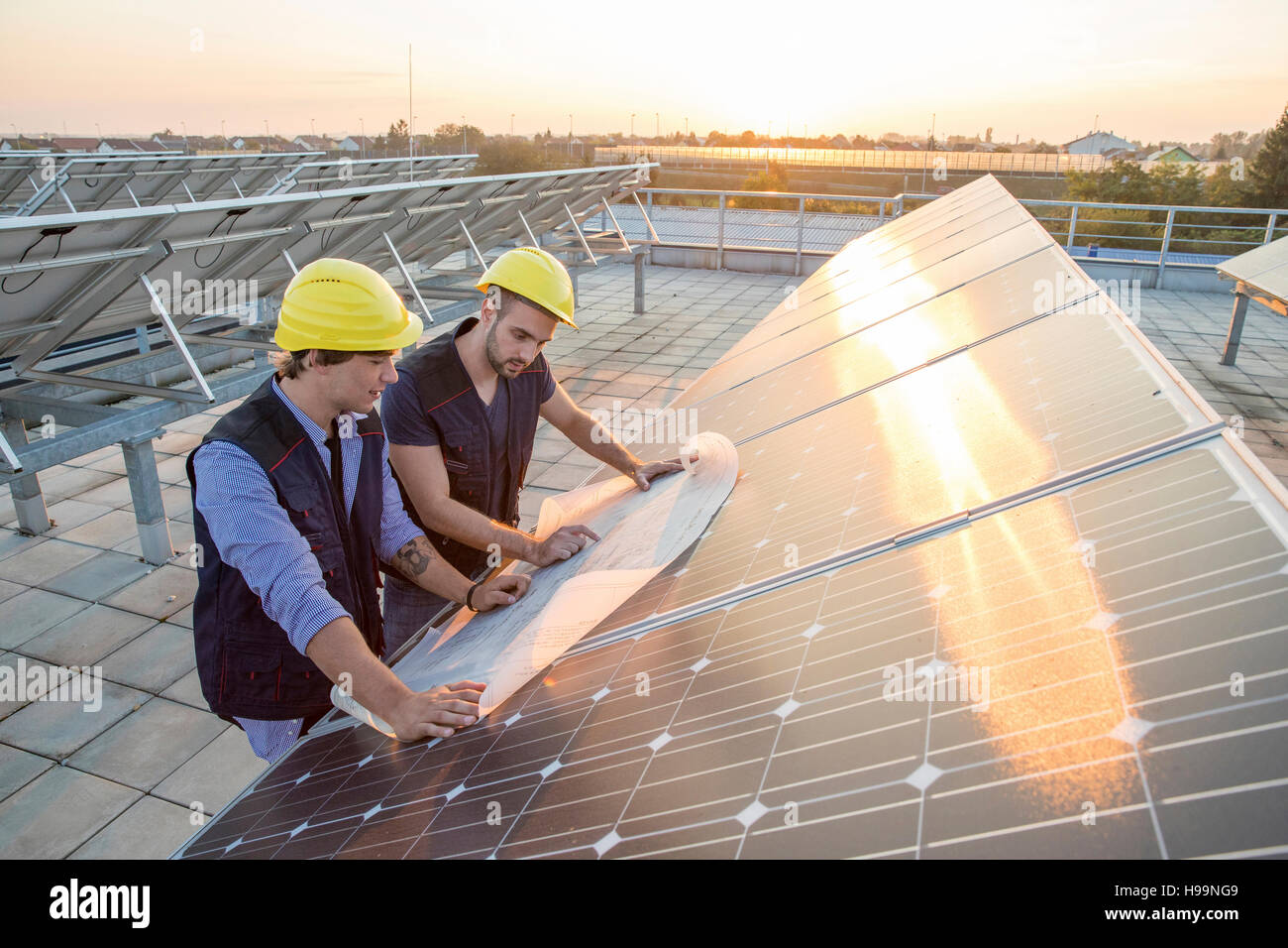 Architect and engineer inspecting solar power station Stock Photo - Alamy