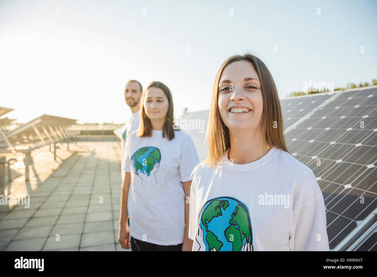 Group of teenage environmentalists in front of solar panels Stock Photo ...