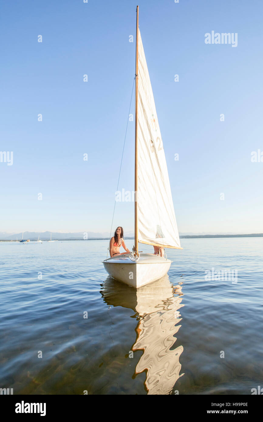 Two young women sailing in dinghy Stock Photo - Alamy