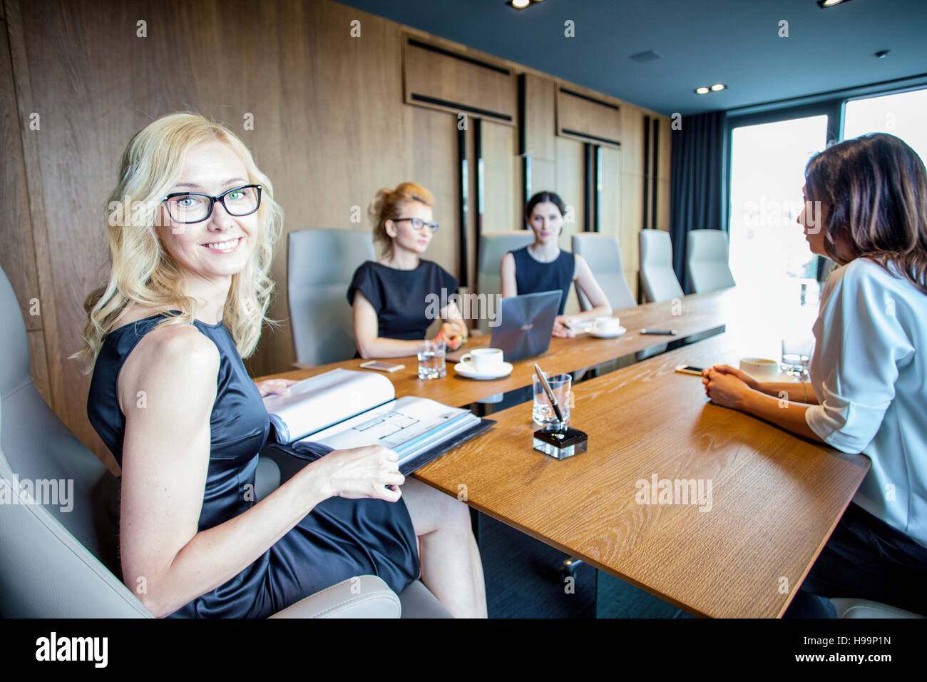 Businesswomen having a meeting in conference room Stock Photo - Alamy
