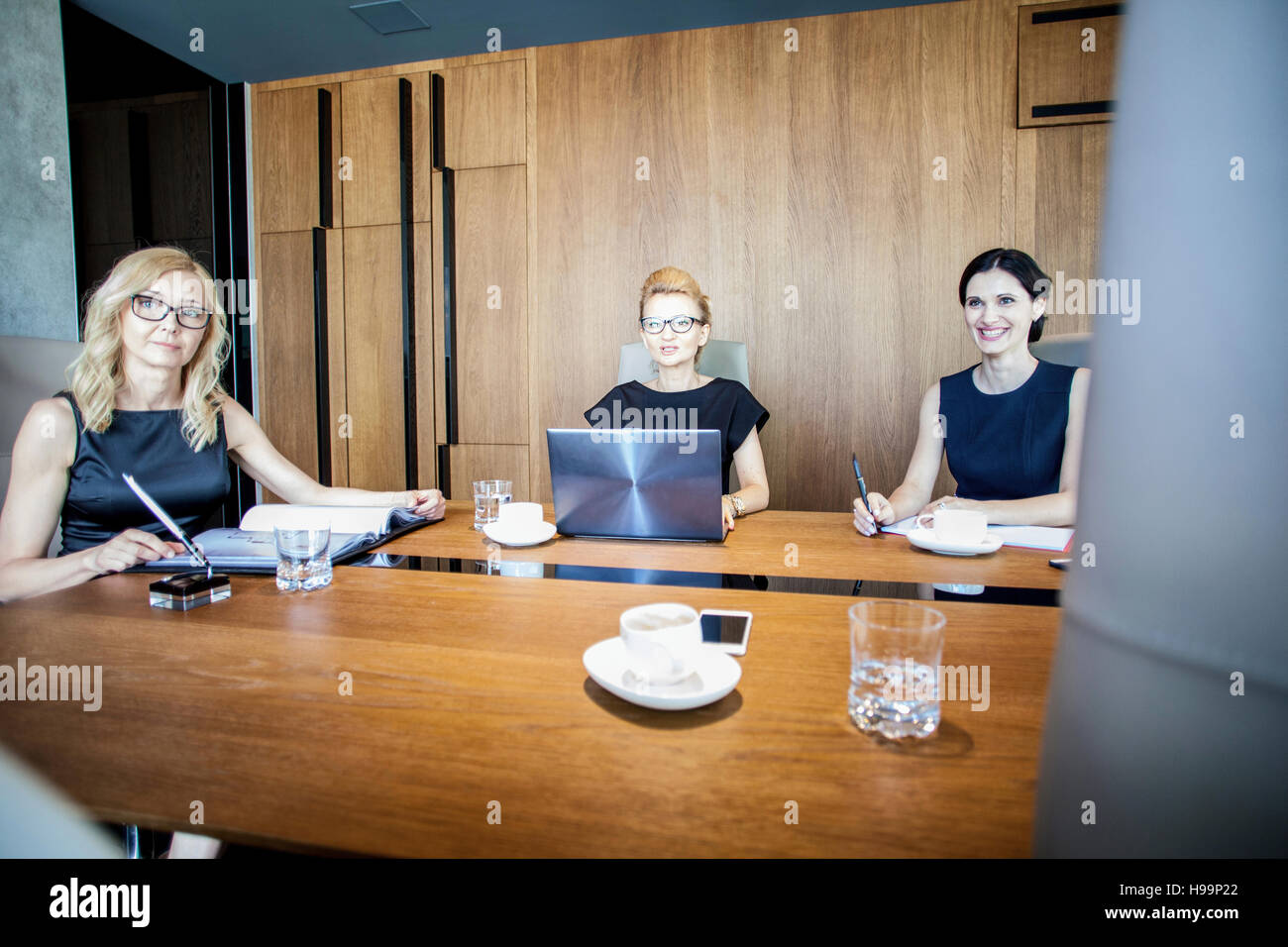 Businesswomen having a meeting in conference room Stock Photo - Alamy