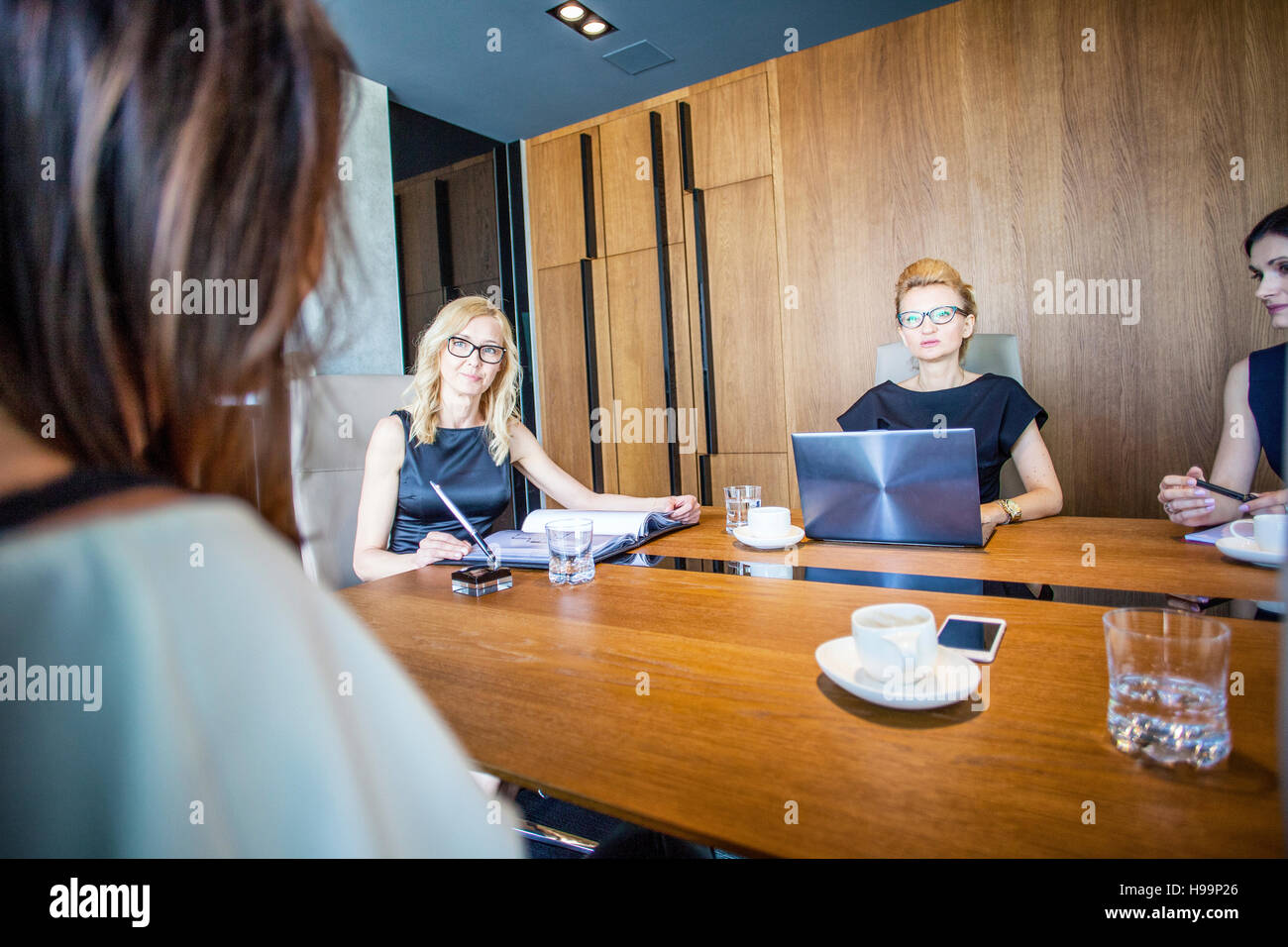 Businesswomen having a meeting in conference room Stock Photo - Alamy