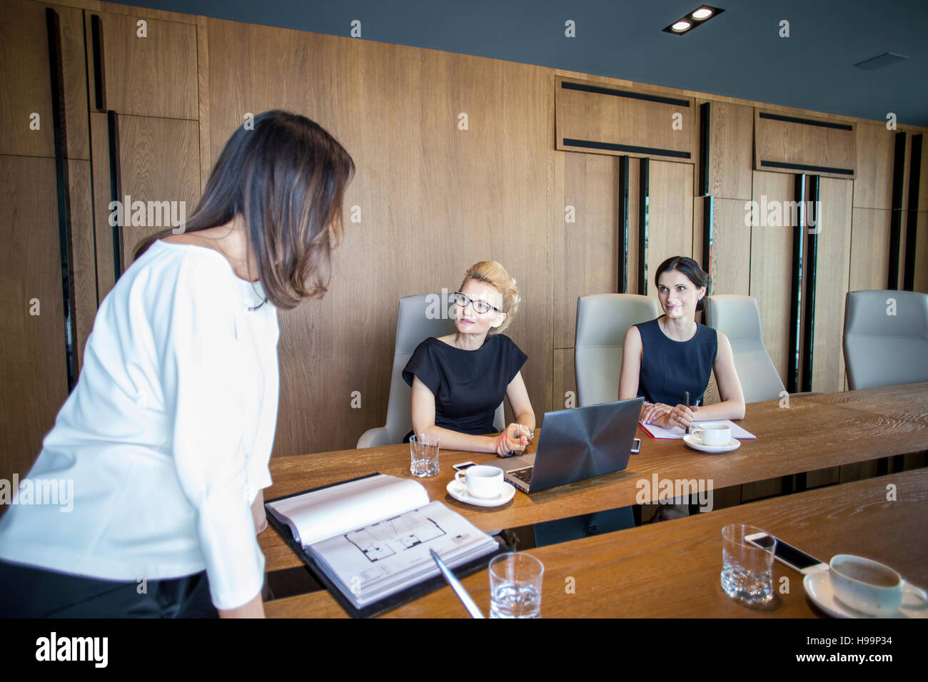 Businesswomen having a meeting in conference room Stock Photo - Alamy