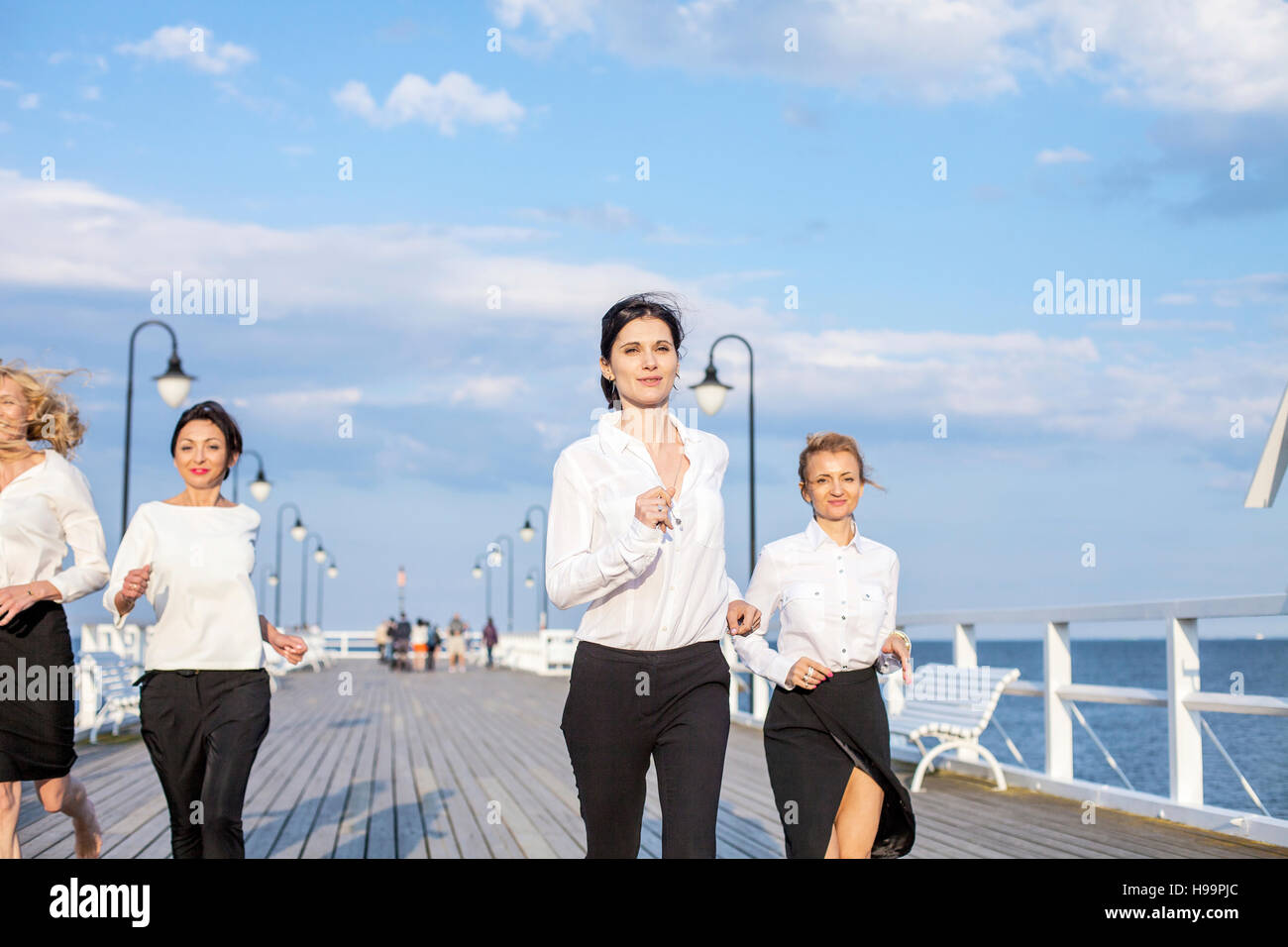 Group running into sea hi-res stock photography and images - Alamy
