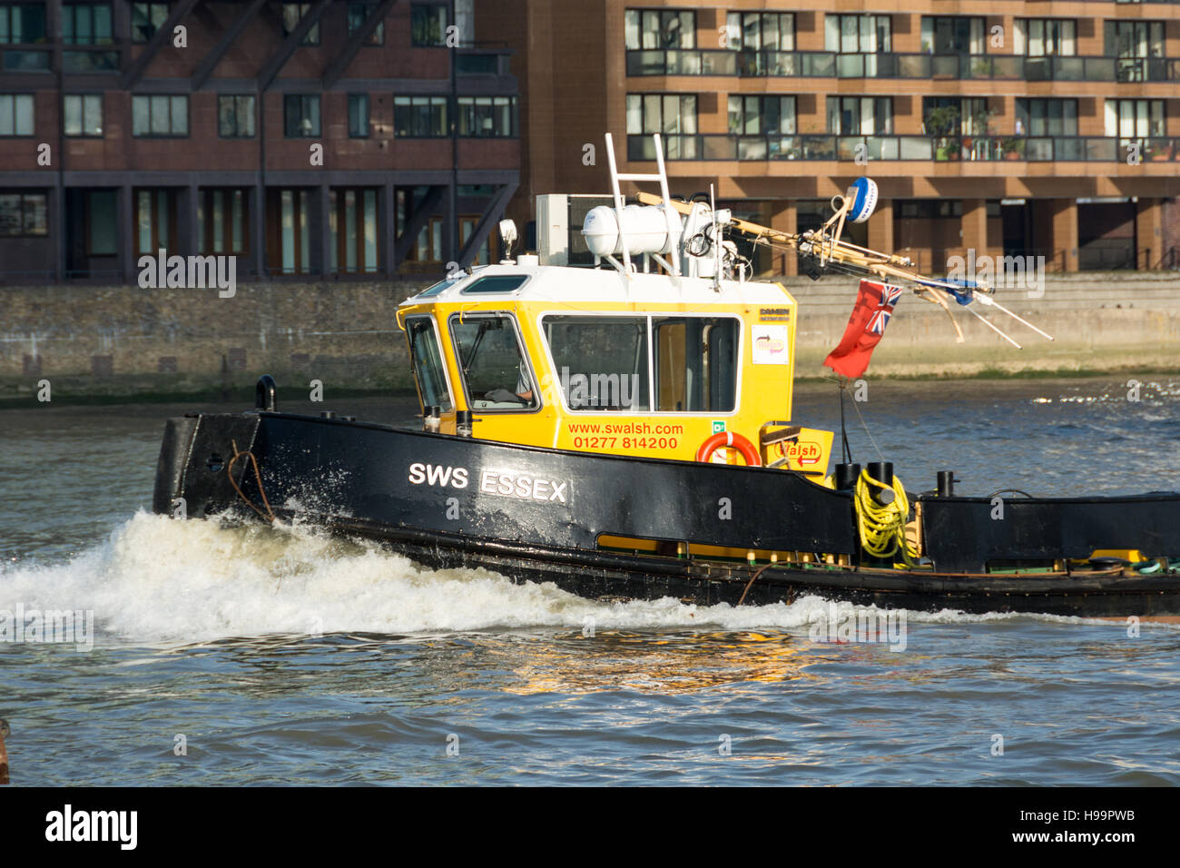 A powerful tug on the River Thames in London, England, UK Stock Photo ...