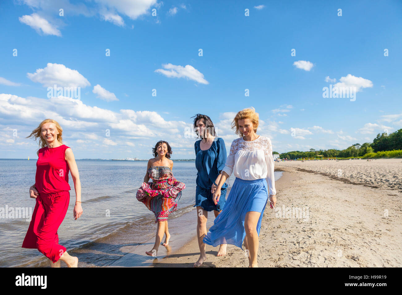 Group women beach walking mature hi-res stock photography and images ...