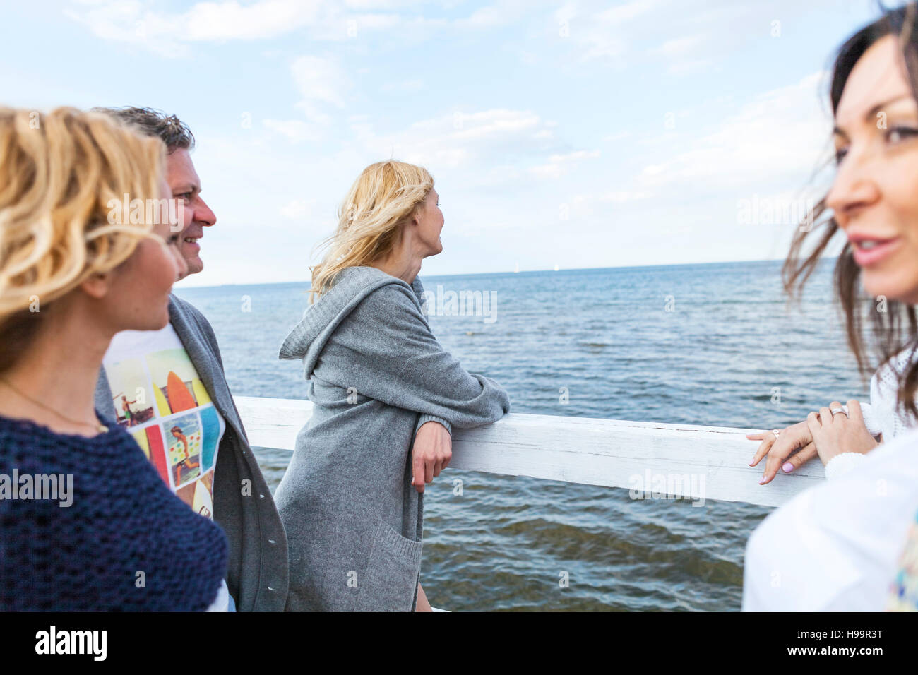 Group people looking over railing hi-res stock photography and images ...