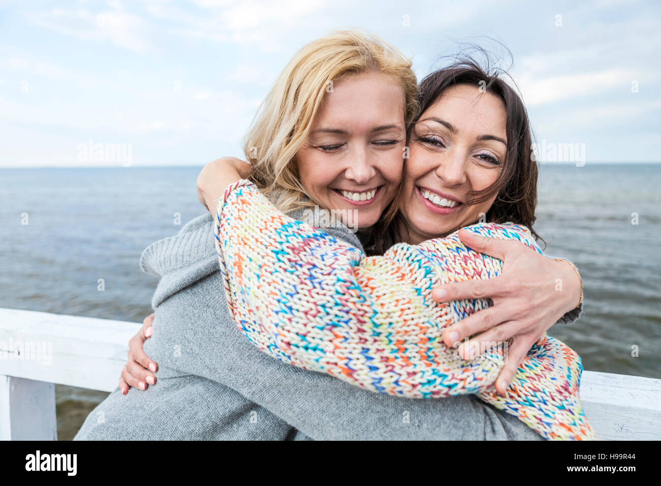 Two woman embracing hi-res stock photography and images - Alamy