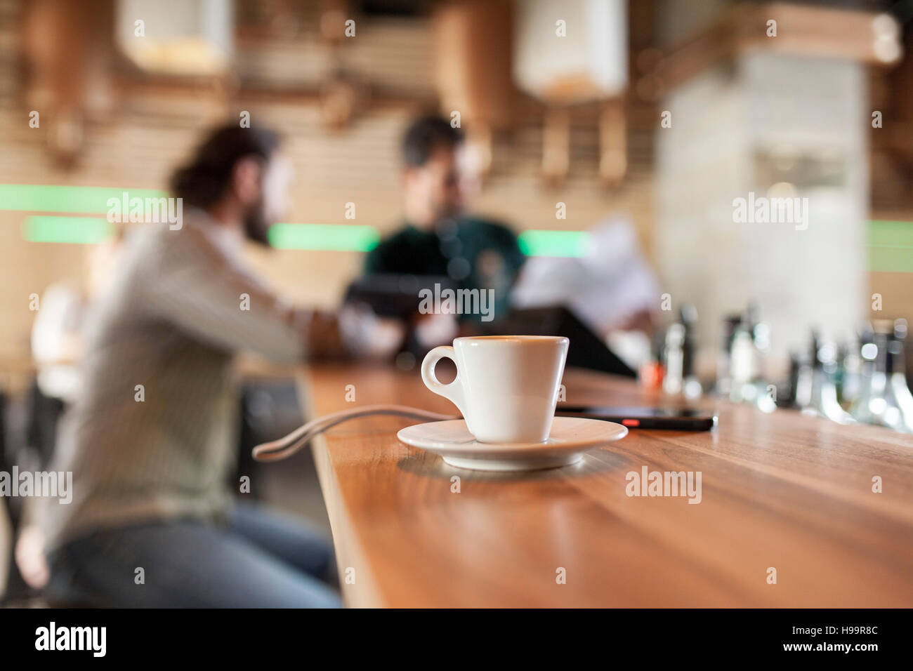 Espresso cup placed on bar counter Stock Photo - Alamy