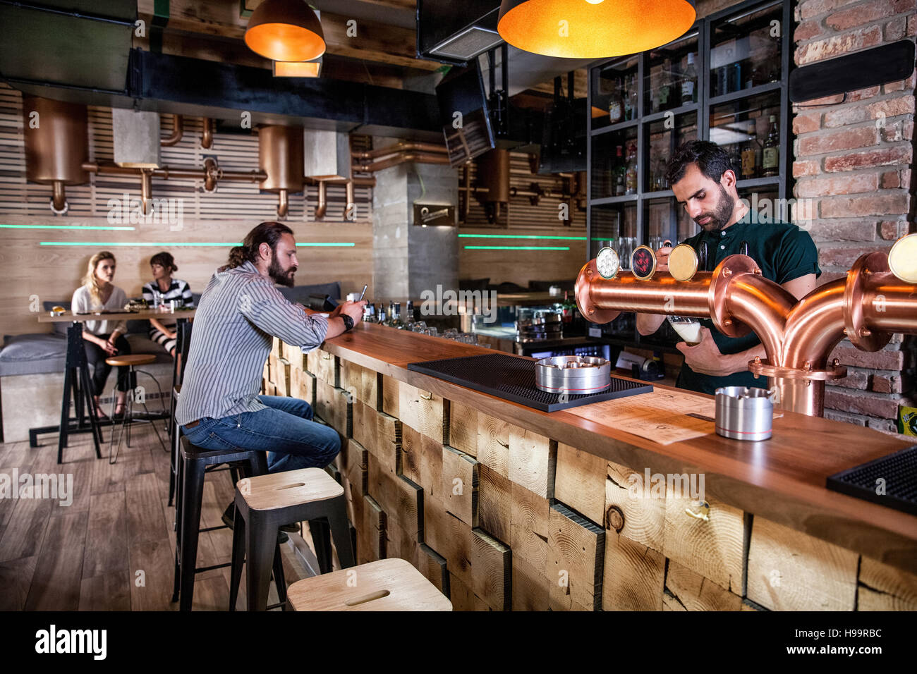 Male guest sitting bar counter hi-res stock photography and images - Alamy