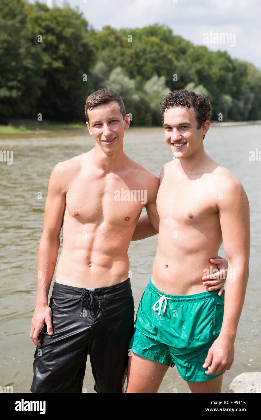 Two young shirtless men on the riverbank Stock Photo - Alamy Two young shirtless men on the riverbank Stock Photo - Alamy