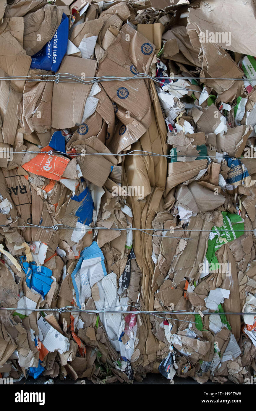 Piles of used cardboard ready for recycling in a factory Stock Photo ...
