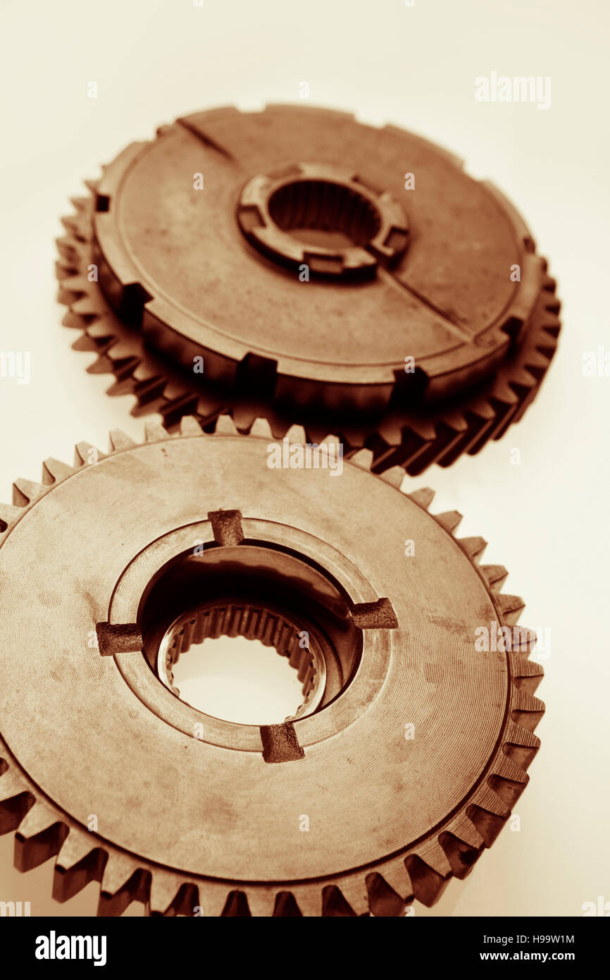 Closeup of two metal cog gears Stock Photo - Alamy