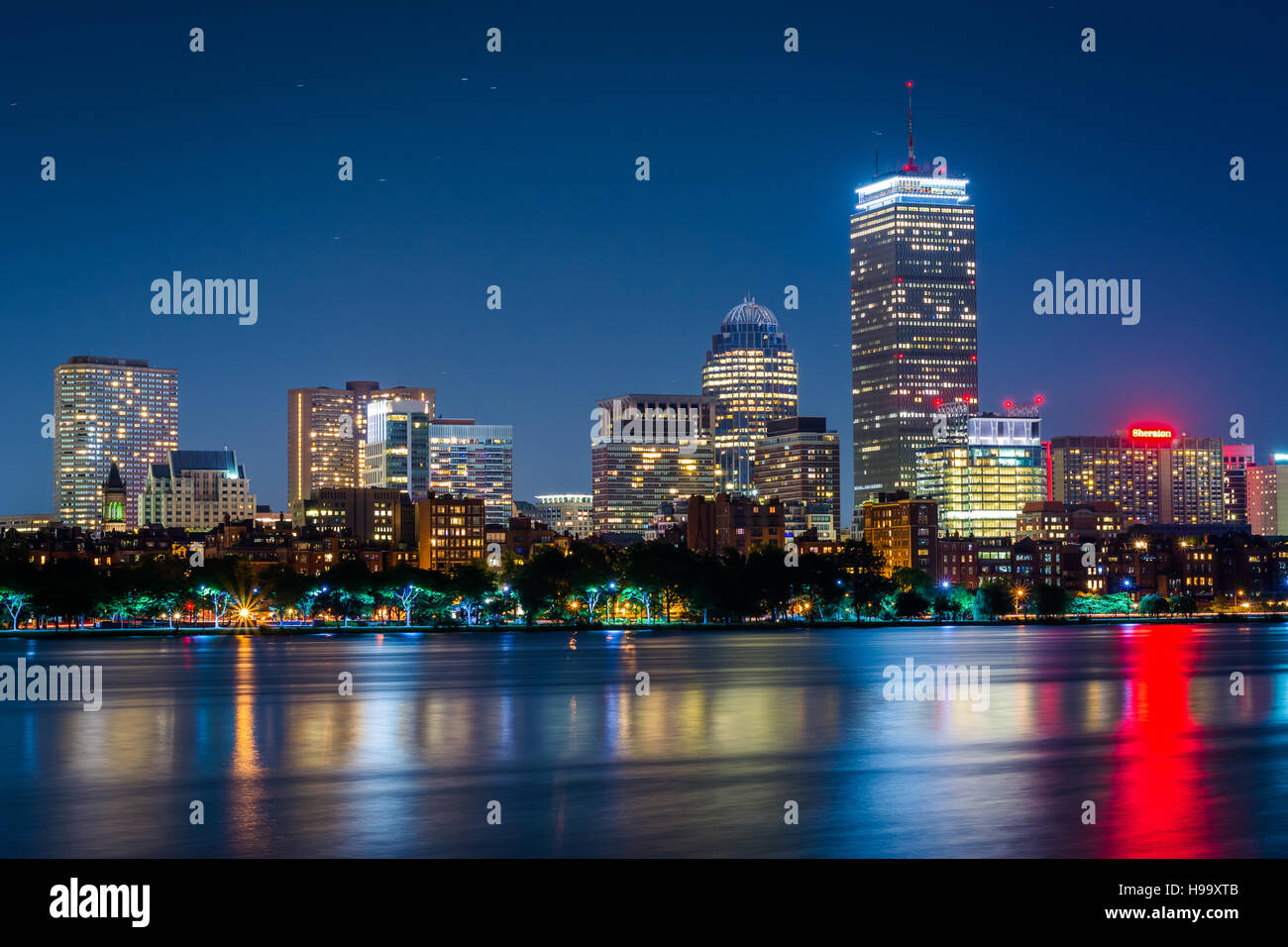 The Charles River and skyline of Boston at night, seen from Cambridge ...